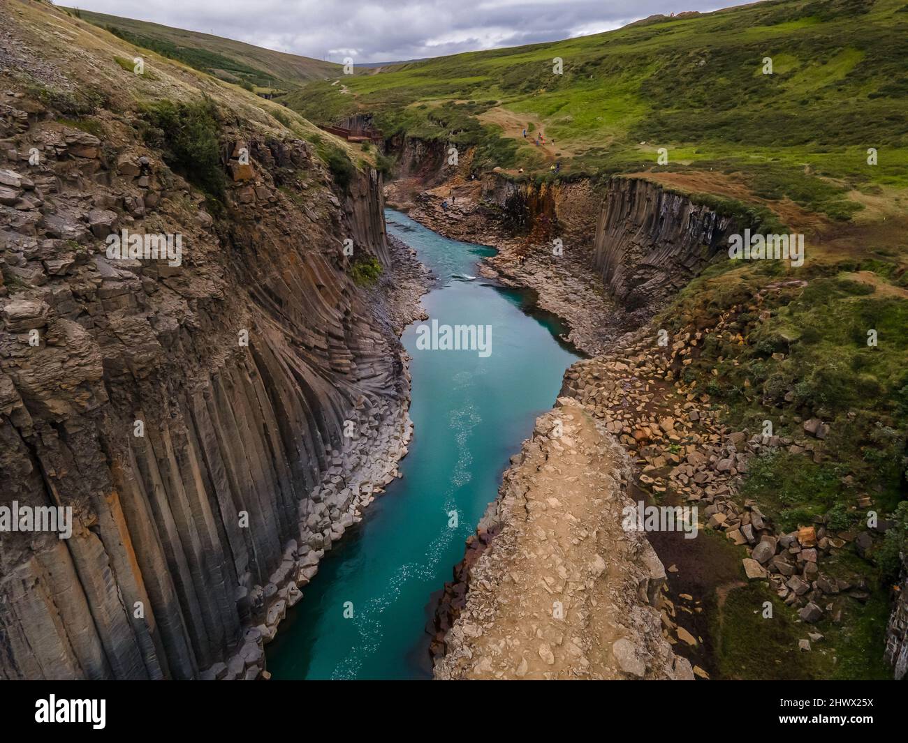 Beautiful aerial view of the studlagil canyon, and the largest number of basalt rock columns in ...