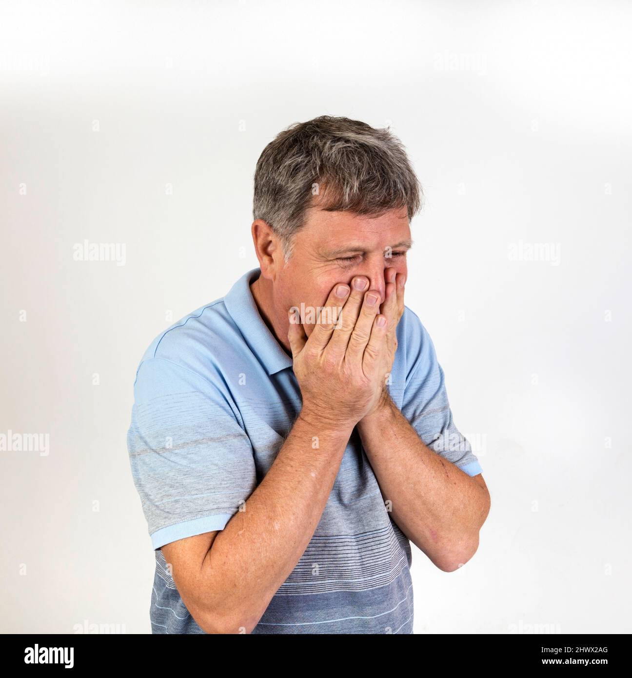 Studio Portrait of handsome man in sorrow looks at the camera Stock ...