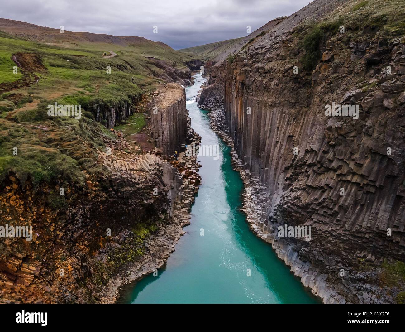 Beautiful aerial view of the studlagil canyon, and the largest number of basalt rock columns in ...
