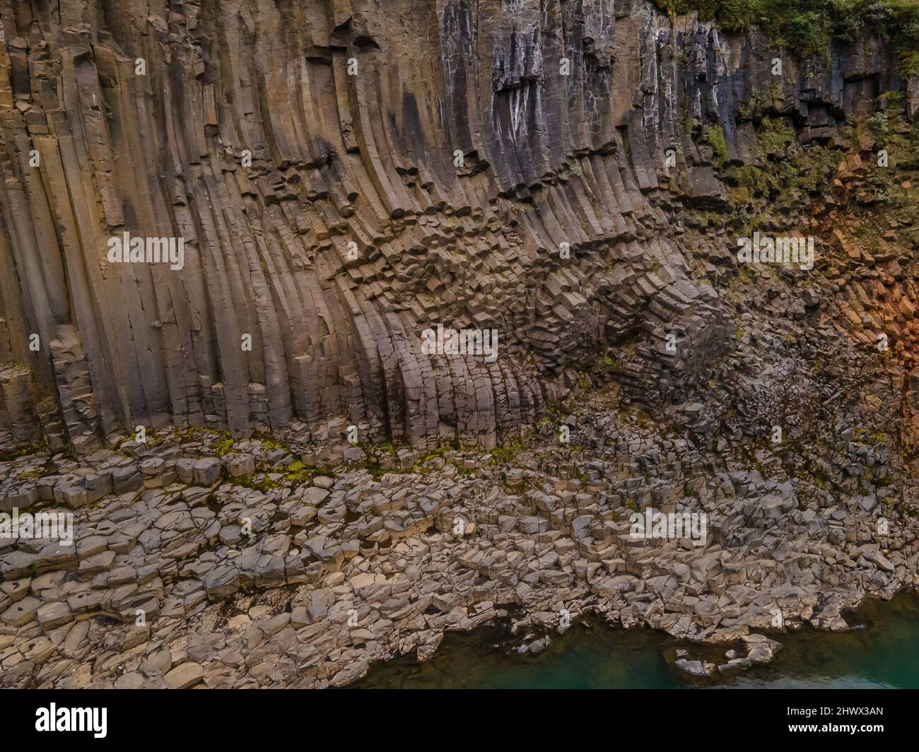Beautiful aerial view of the studlagil canyon, and the largest number of basalt rock columns in ...