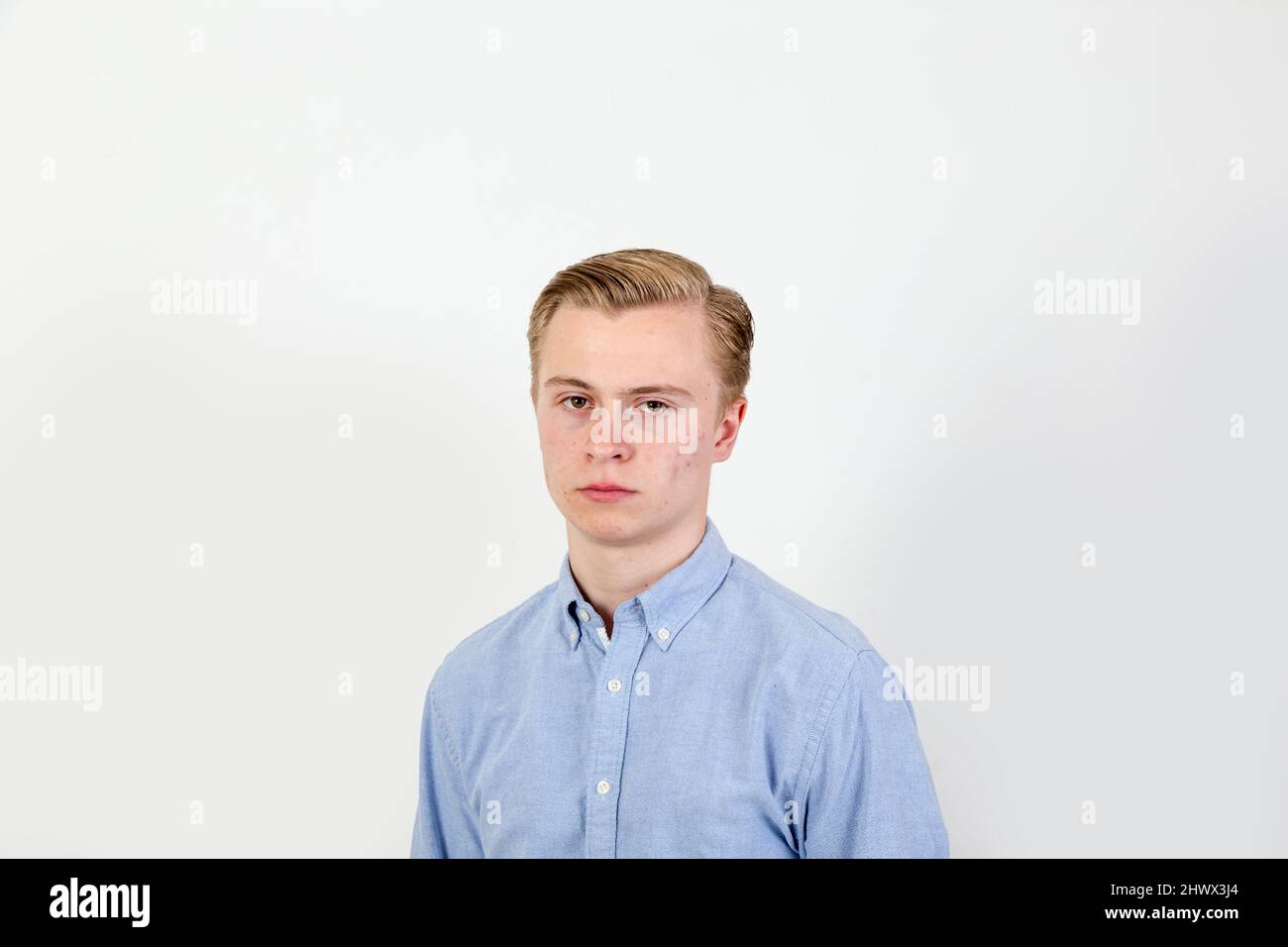 portrait of sad teenage boy with brown hair Stock Photo - Alamy