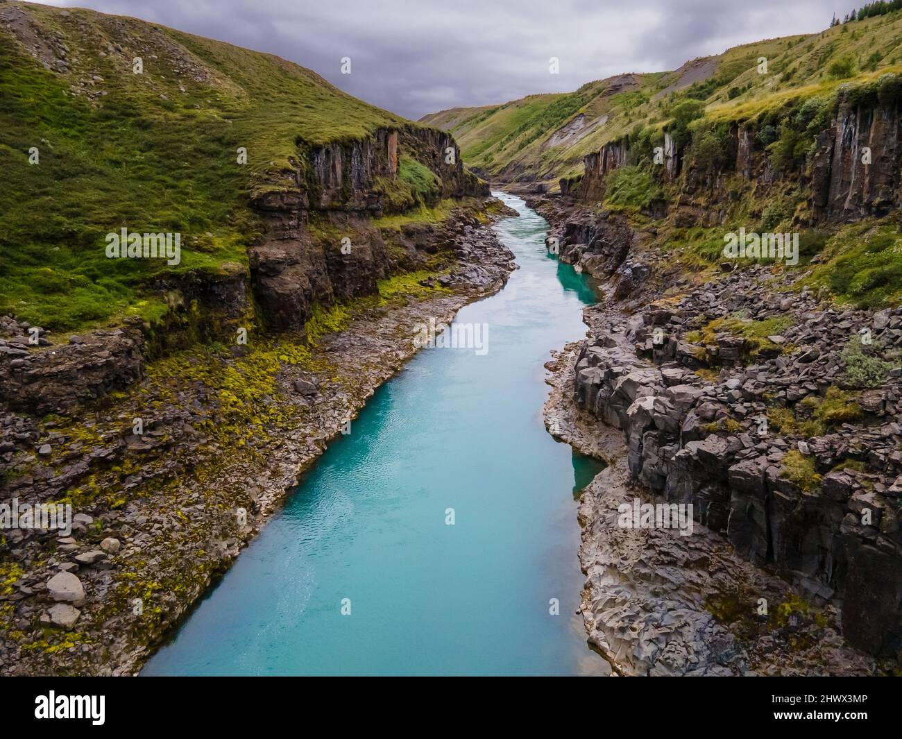 Beautiful aerial view of the studlagil canyon, and the largest number of basalt rock columns in ...
