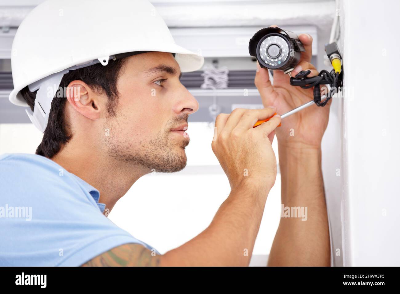 Your home security is in capable hands. Shot of a handsome young man ...