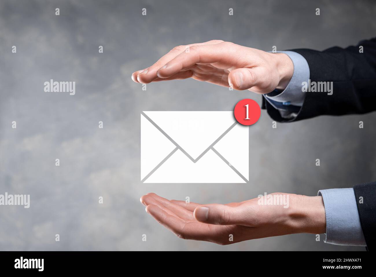 Businessman hand holding e-mail icon, Contact us by newsletter email ...