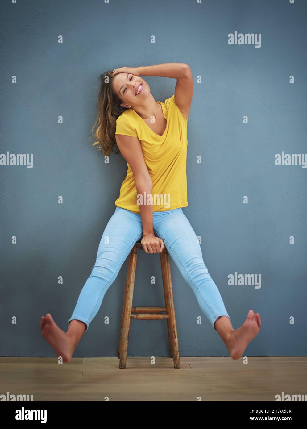 Positivity is contagious, pass it on. Shot of a young woman sitting on ...