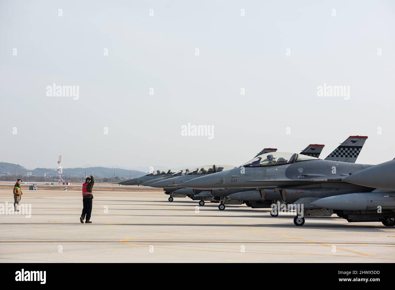F-16 Fighting Falcon pilots with the 36th Fighter Squadron await their ...