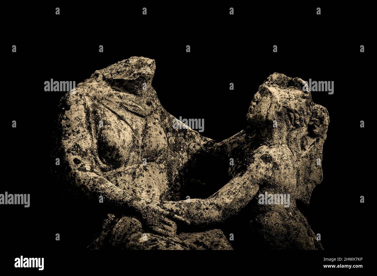 Poignant embrace between a winged child and a headless woman amongst ...