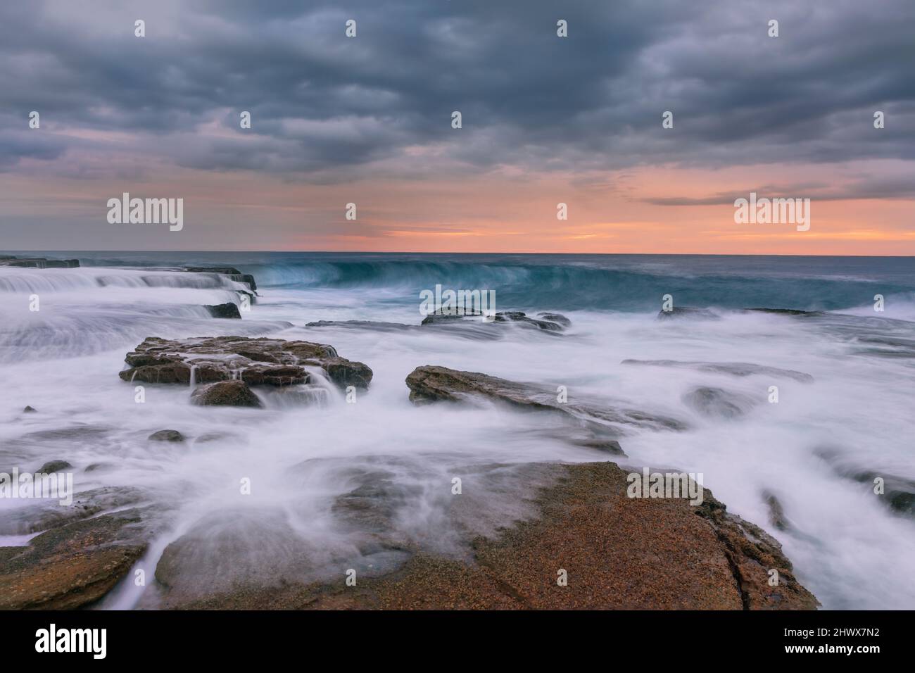 Ocean wave rises up in early morning Stock Photo - Alamy