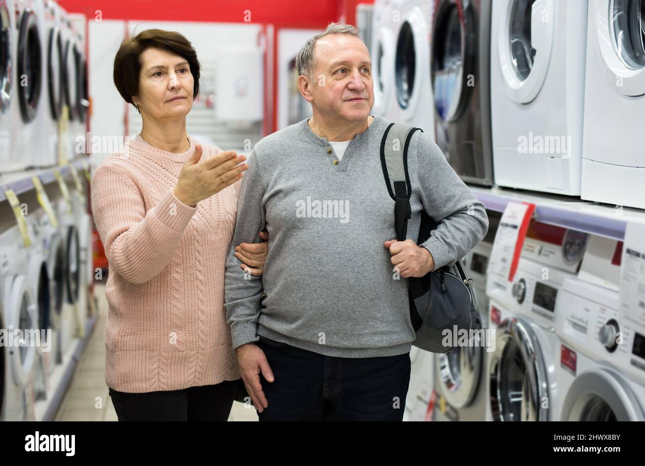 Mature woman washing machine hi-res stock photography and images - Alamy