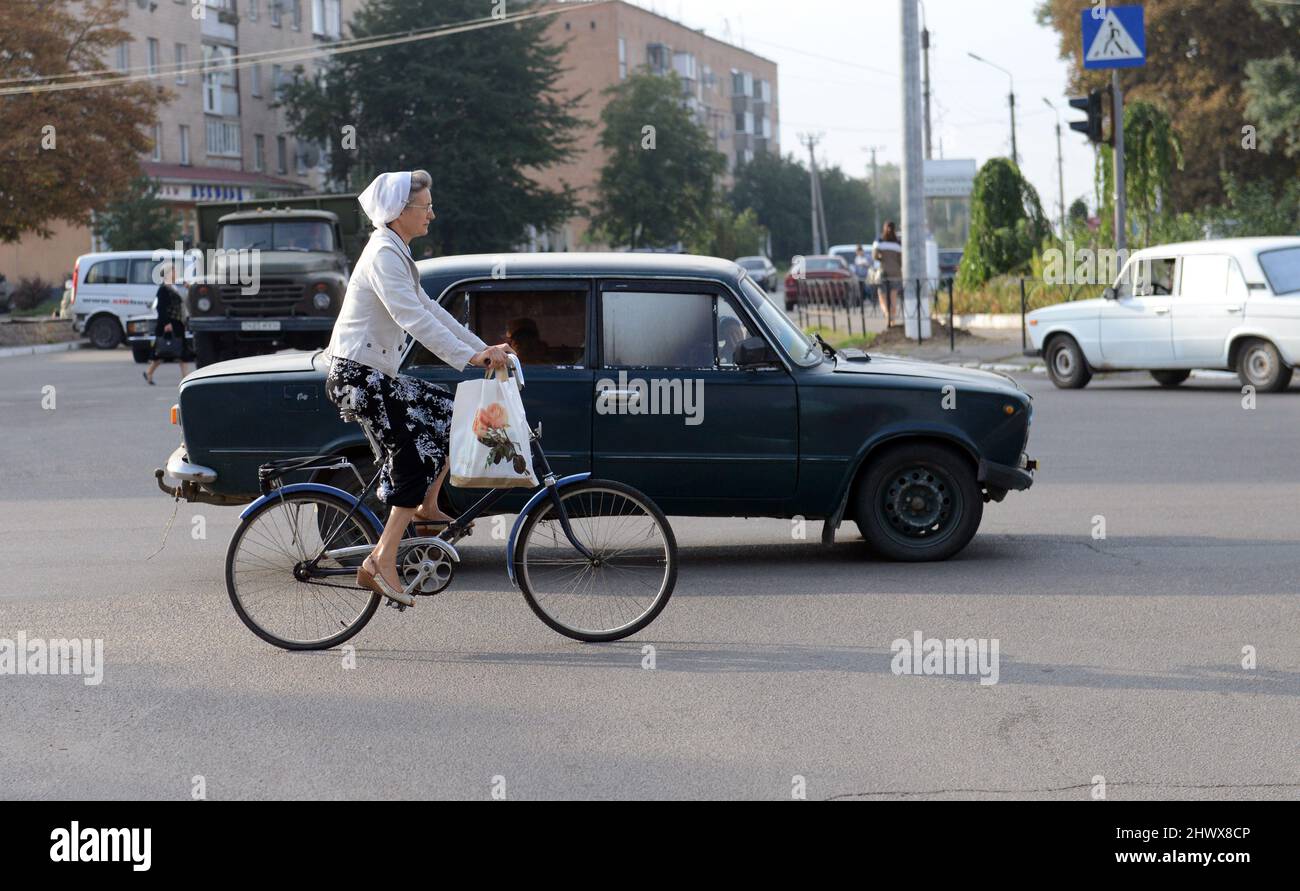 Ukrainian woman riding bicycle hi-res stock photography and images - Alamy