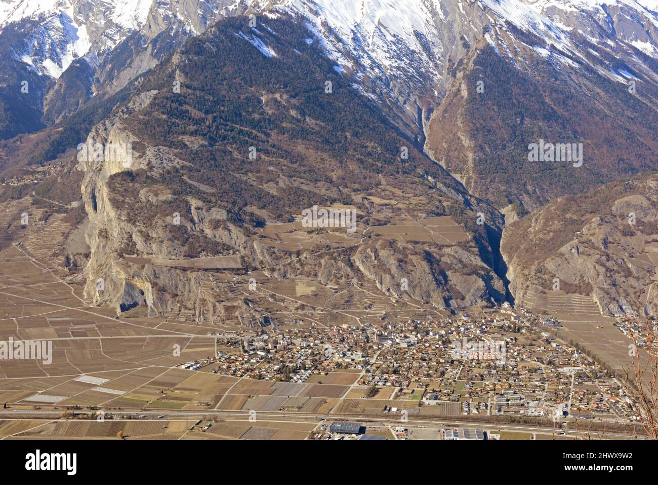 The town of Ardon and its vineyards at the foot of the Bernese Alps in ...