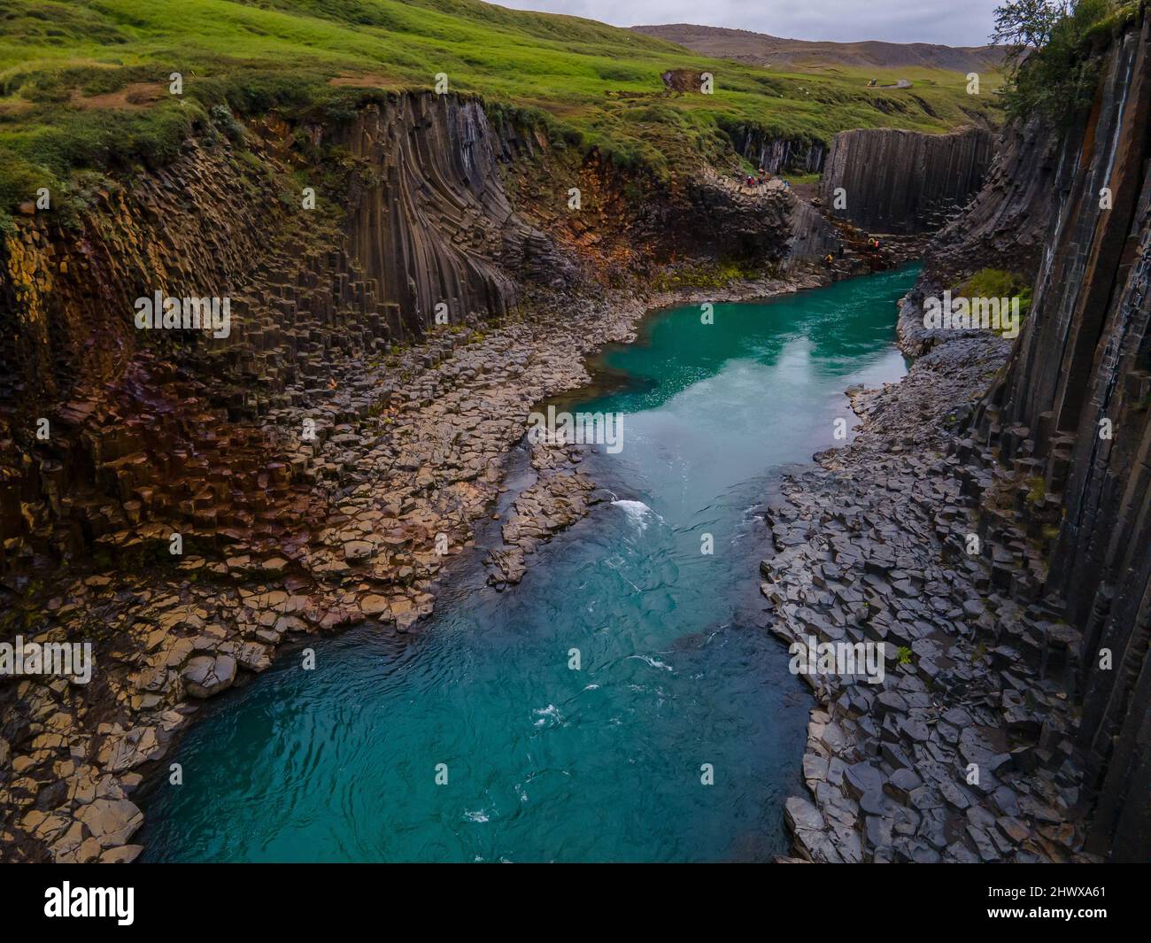 Beautiful aerial view of the studlagil canyon, and the largest number of basalt rock columns in ...