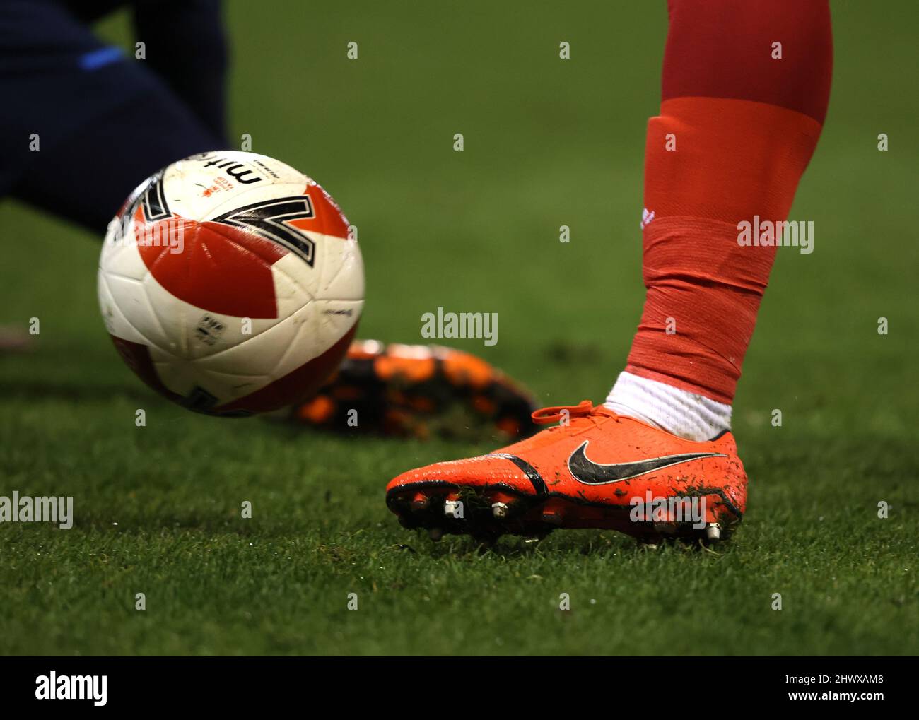 Nottingham, UK. 07th Mar, 2022. An orange Nike football boot, and the ...