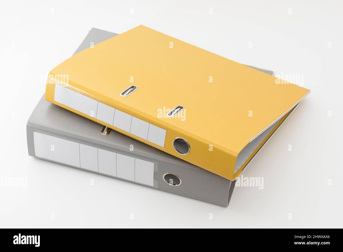 Yellow and gray office folder on white background Stock Photo - Alamy