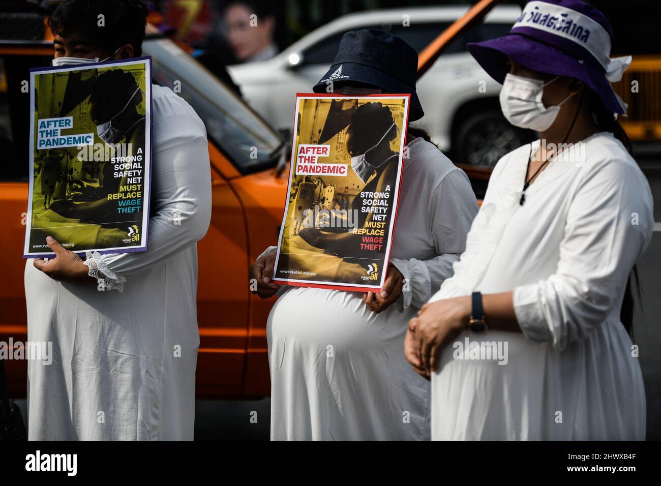 Thailand. 8th Mar, 2022. Members of Thai labour rights groups and state ...