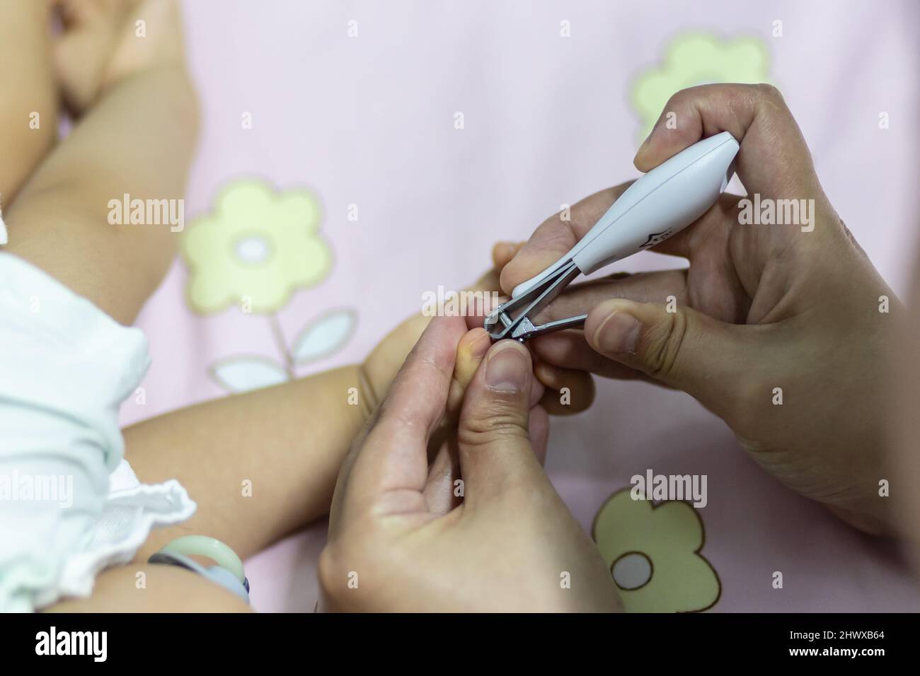 Woman clipping fingernails hi-res stock photography and images - Alamy