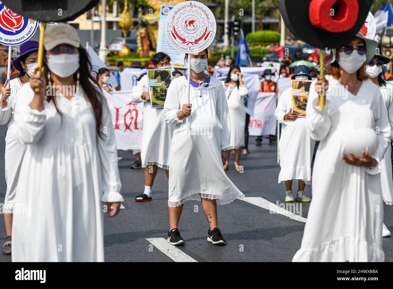 Thailand. 8th Mar, 2022. Members of Thai labour rights groups and state ...