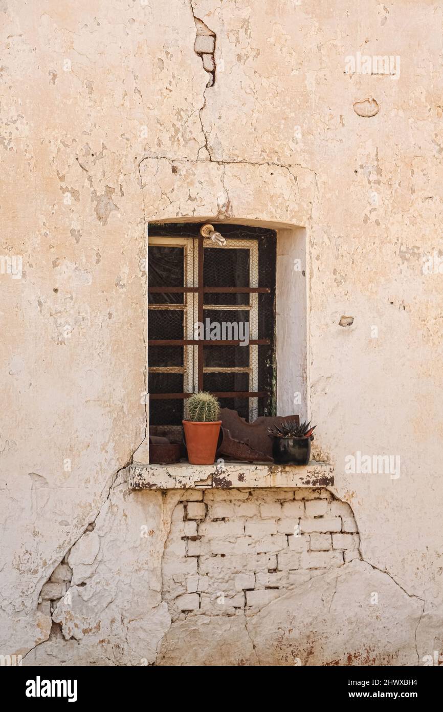 Rustic window on crème wall Stock Photo - Alamy