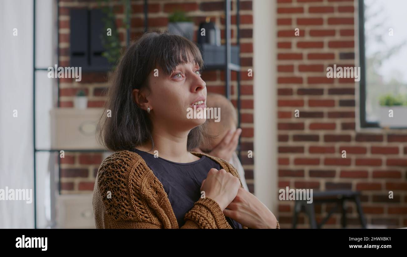 Close up of woman crying and sharing story about alcohol addiction at ...