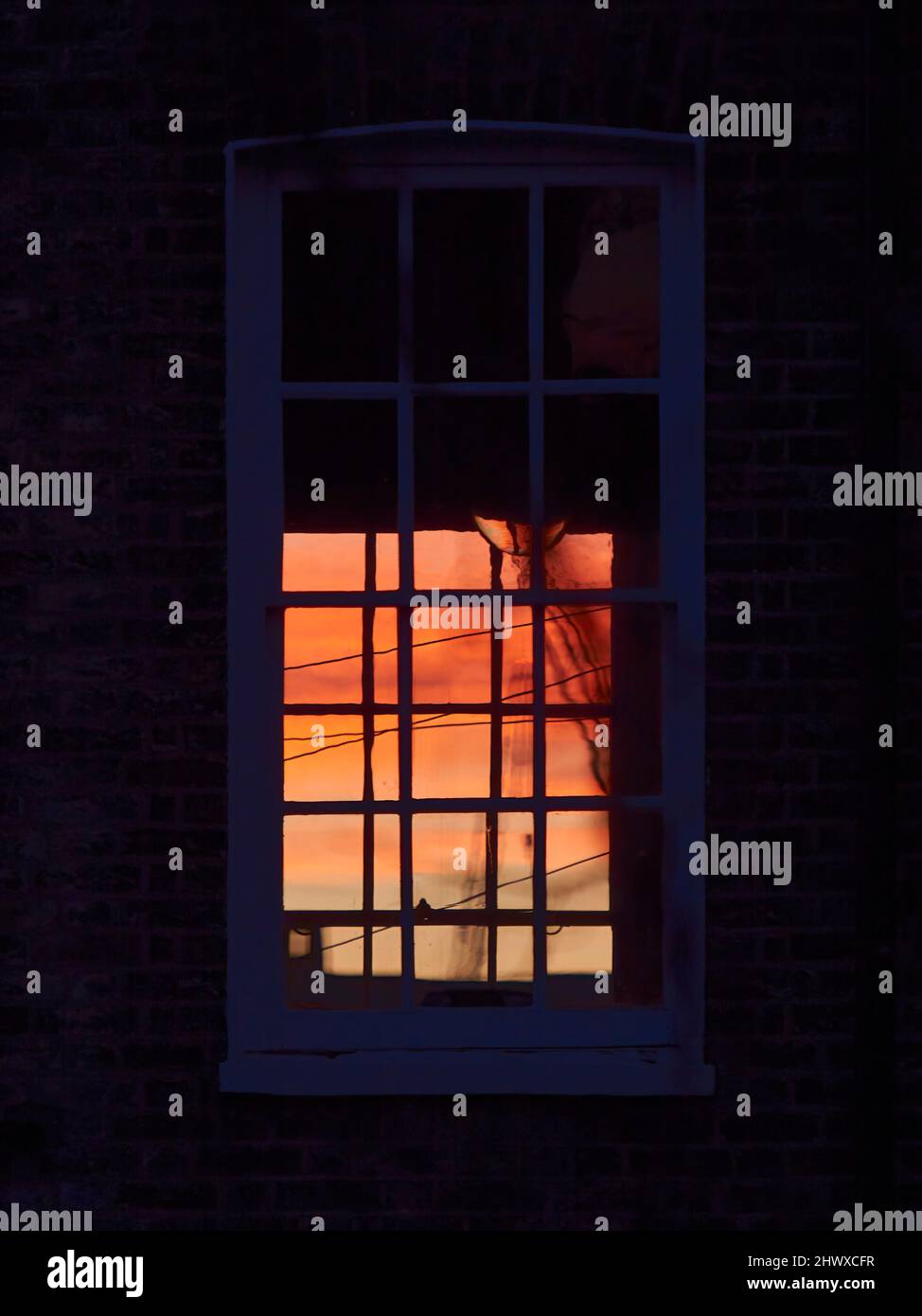 A vibrant London dawn seen through a building’s pair of dual aspect ...