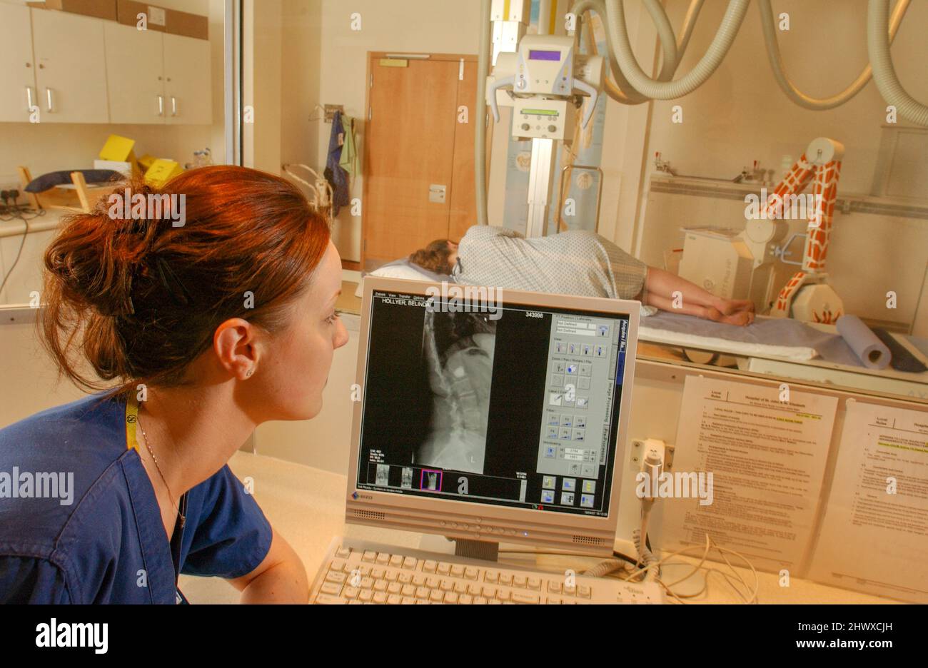 The Radiologist sits in the control room performing the x-ray scan ...