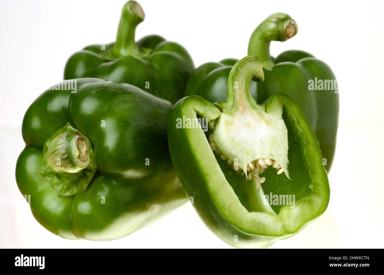 Green bell peppers, whole and cut, are excellent sources of vitamin C ...