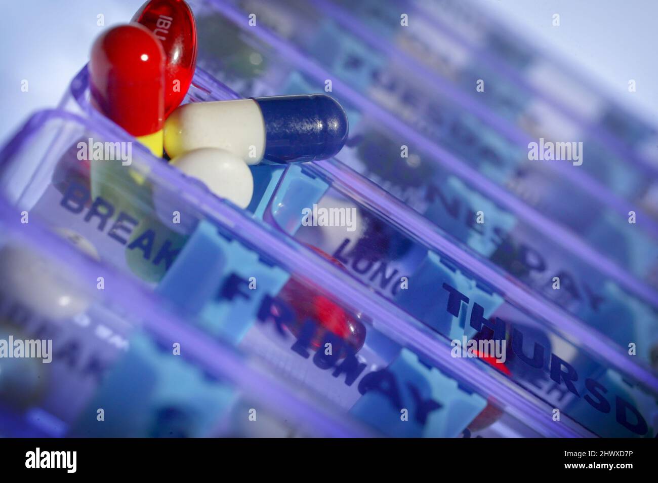 Daily doses pill box labeled with times of the day to remind the user ...