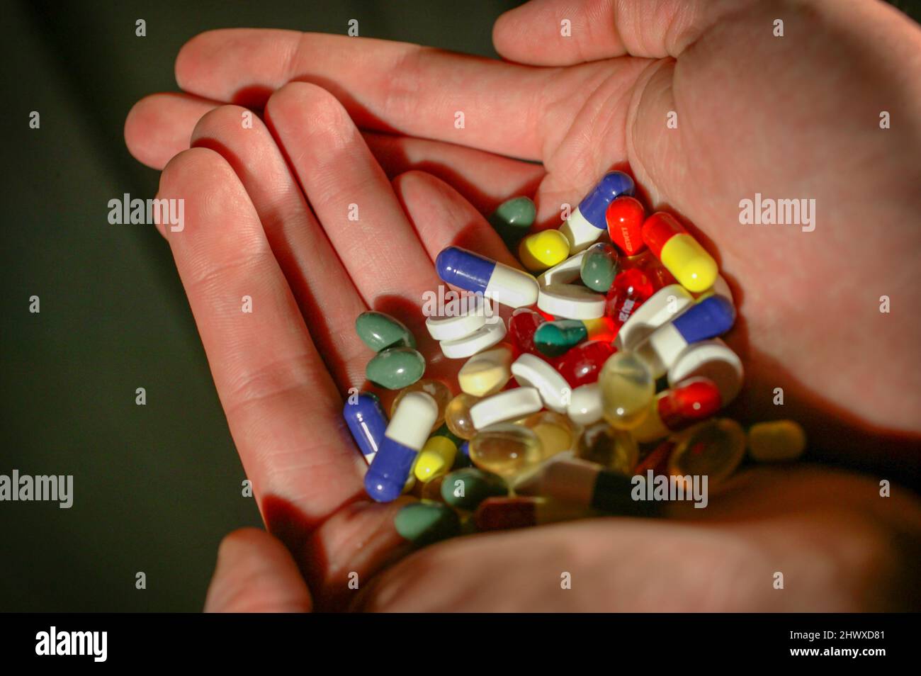 Handful of tablets Stock Photo - Alamy