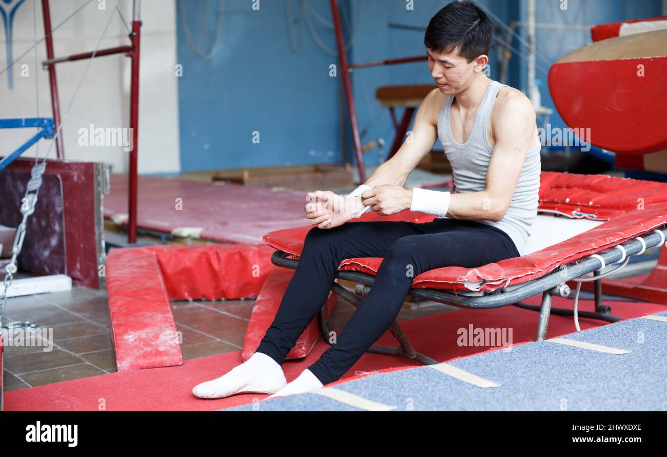 Young man resting in gym Stock Photo - Alamy