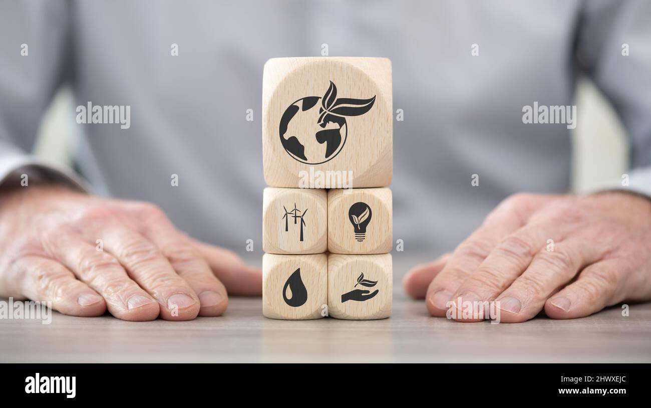 Wooden blocks with symbol of ecology concept Stock Photo - Alamy