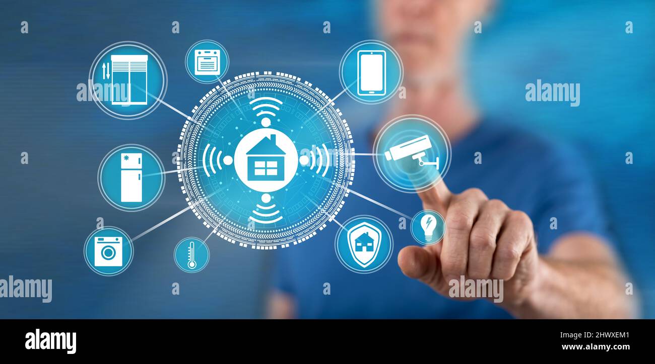 Man touching a smart home concept on a touch screen with his finger ...