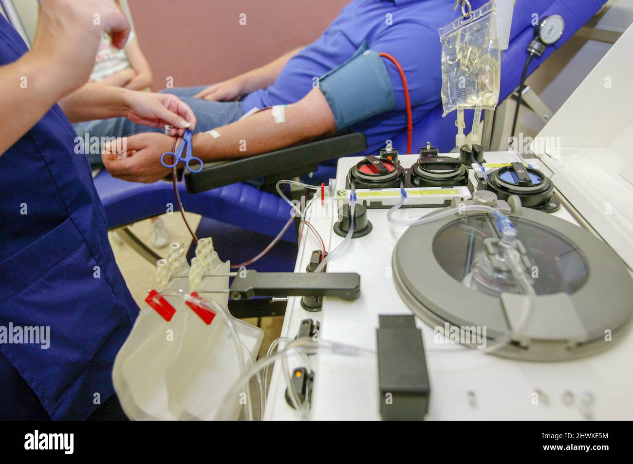 A nurse connects a patient to the Haemonetics MCS. This machine ...