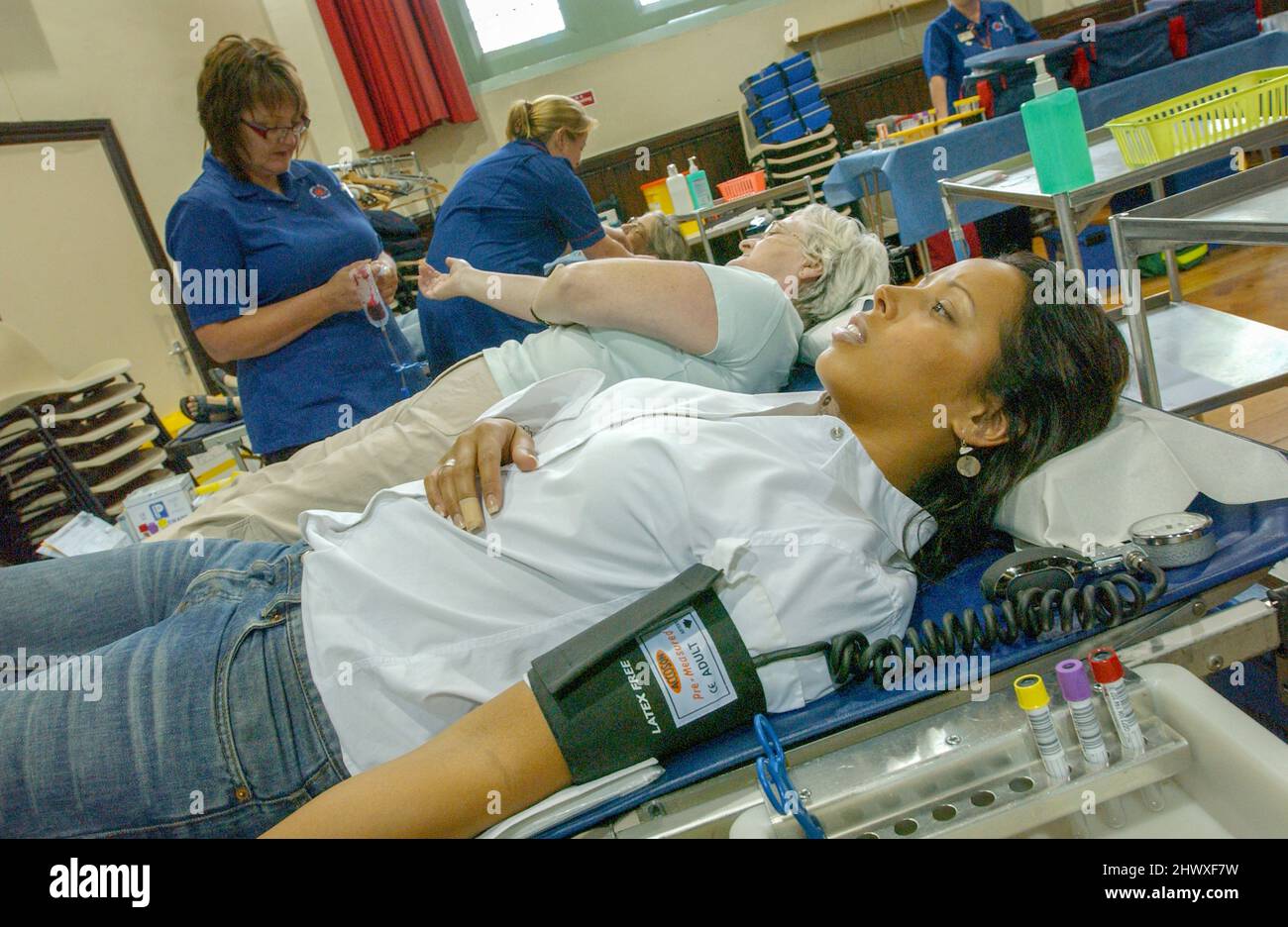 Women blood donors being attended by a nurse at a NHS National Blood ...
