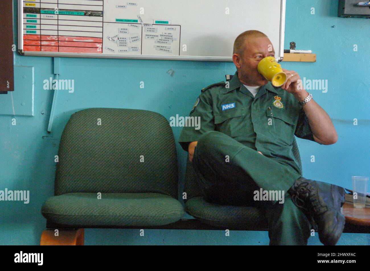 Paramedic sitting in a waiting room waiting to be called to an ...