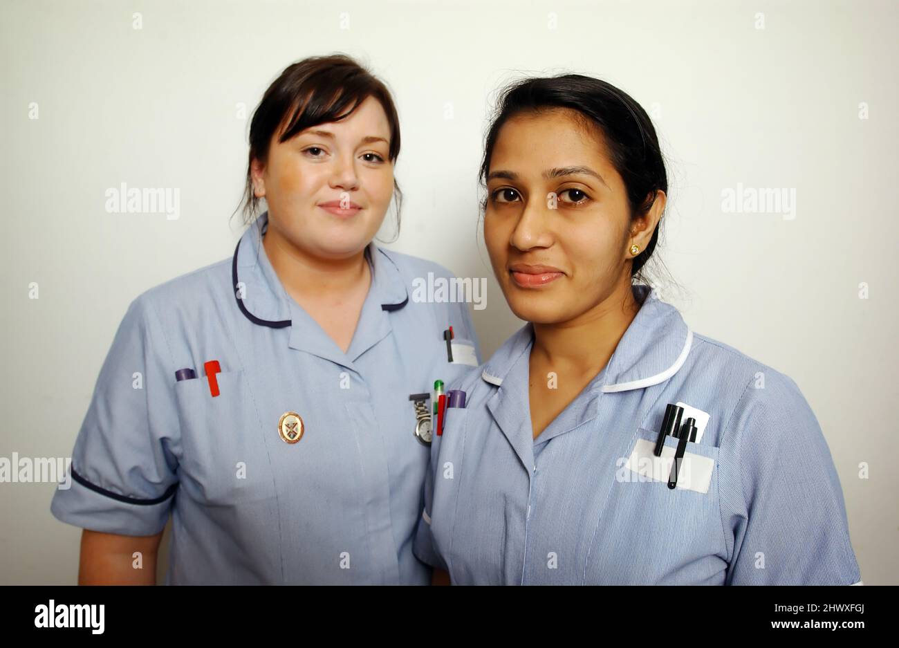 Two female nurses wearing typical blue and white nurses uniform.(MODEL ...