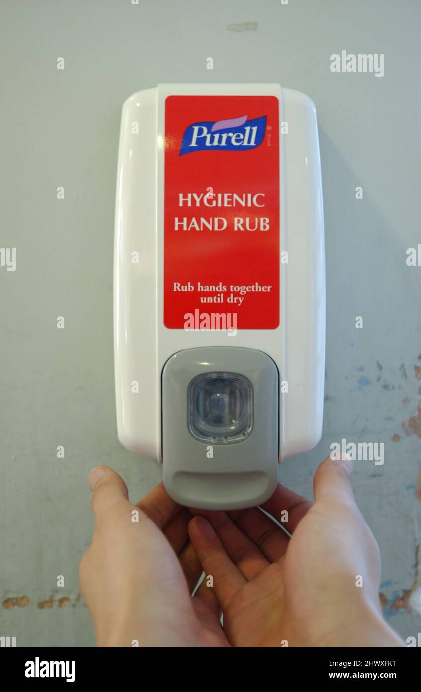 A hand cleansing liquid depenser. The liquid contains an alcohol rub ...