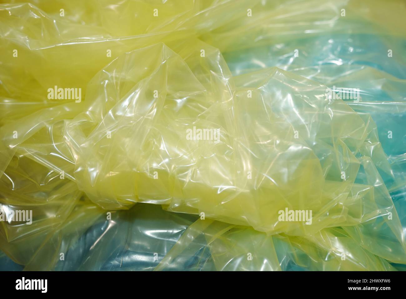 Part of crumpled cellophane of yellow color prepared for wrapping small ...
