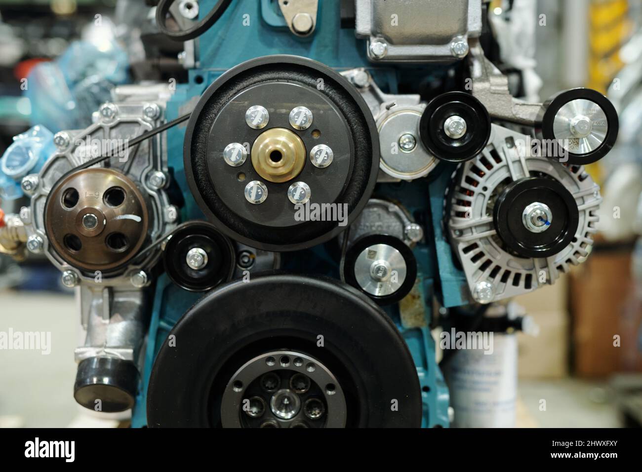 Close-up of working engine of huge industrial machine with rotating ...