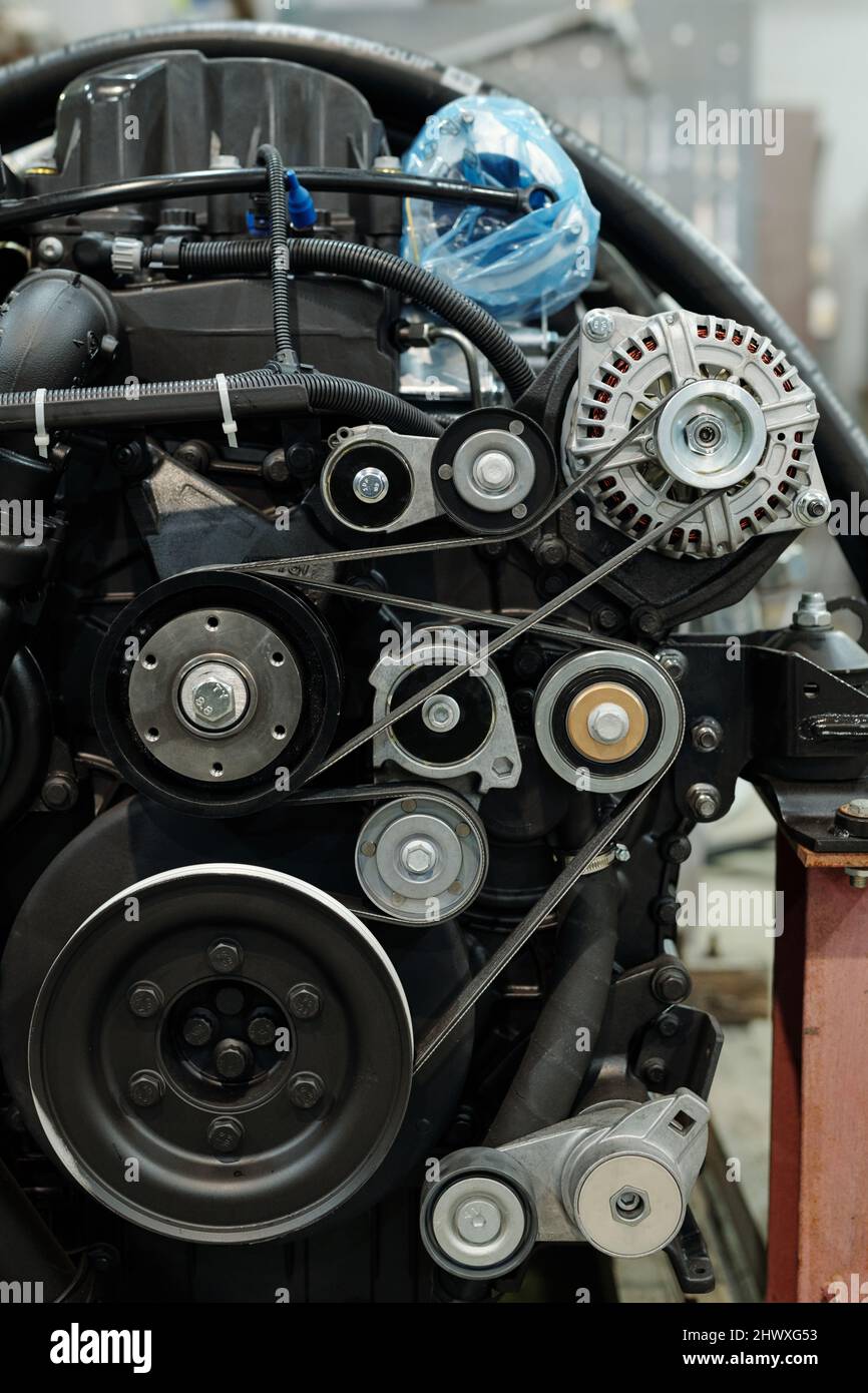 Front part of large engine of huge industrial automated machine with ...