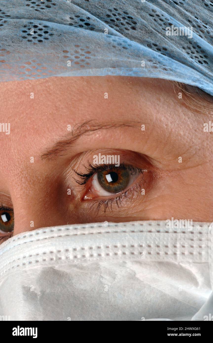 Close up of a hospital worker's eye and eyebrow, also showing part of ...