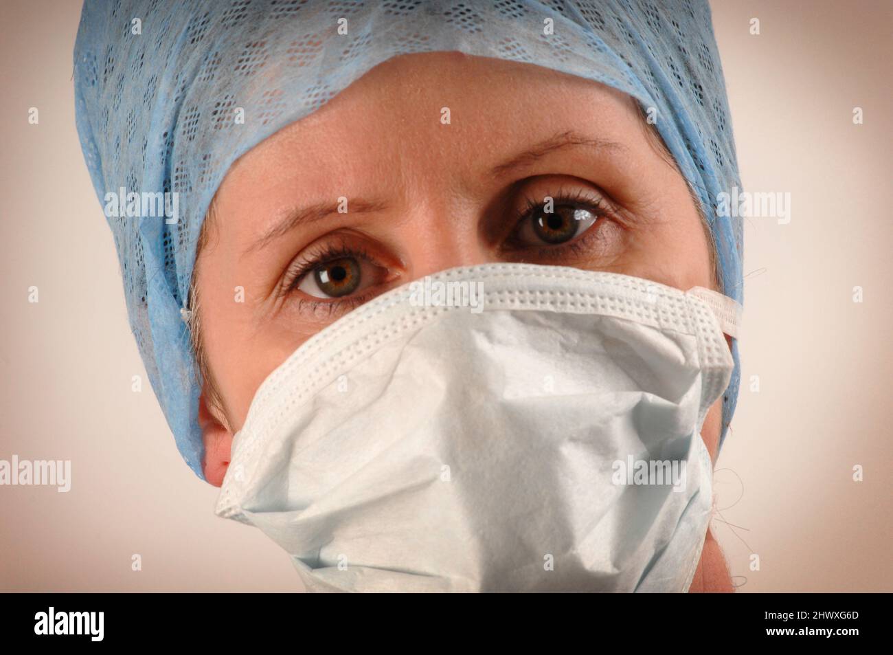 Close up of a hospital worker wearing a hygiene mask and hat( MODEL ...