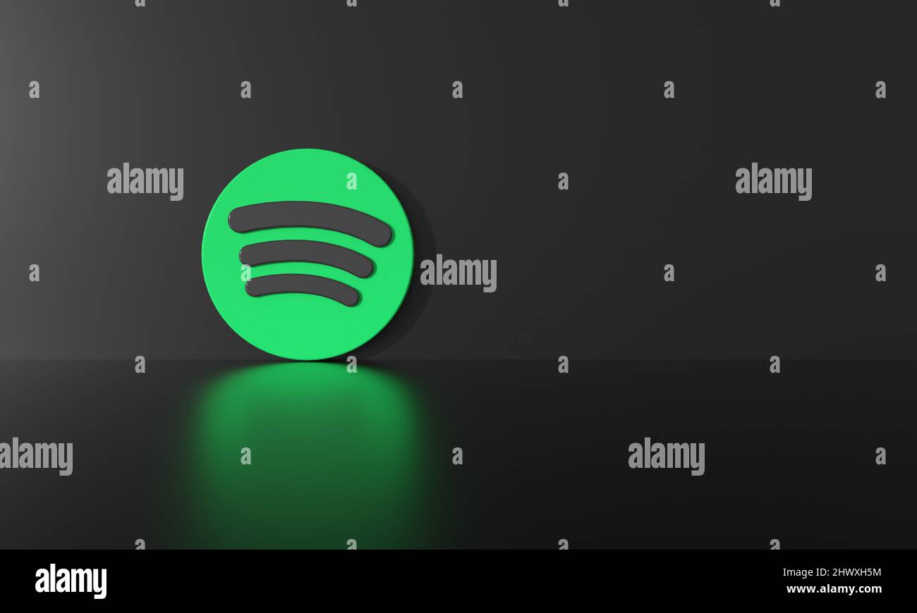 Spotify logo on black wall background and reflective floor with hard ...
