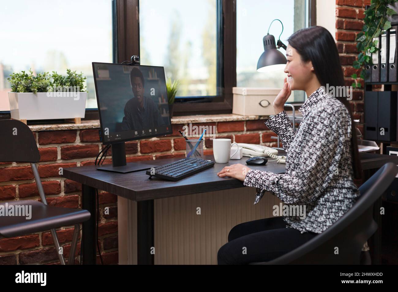 Agency office worker in virtual remote video conference with accounting ...
