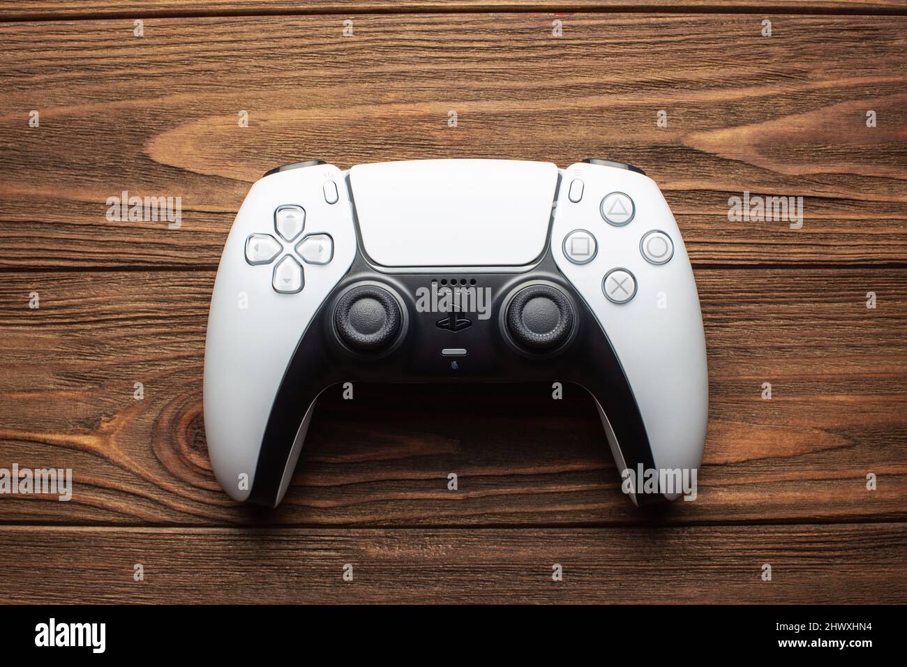 Dualsense ps5 controller on wooden background, gaming concept Stock ...