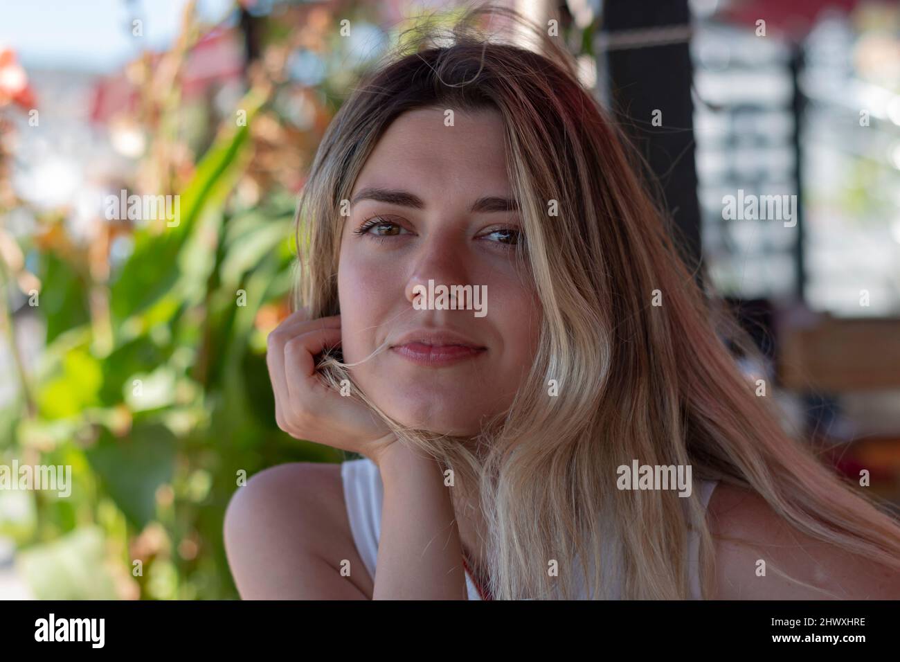 Portrait of a woman. Close up photo. She looks forward and smiling ...