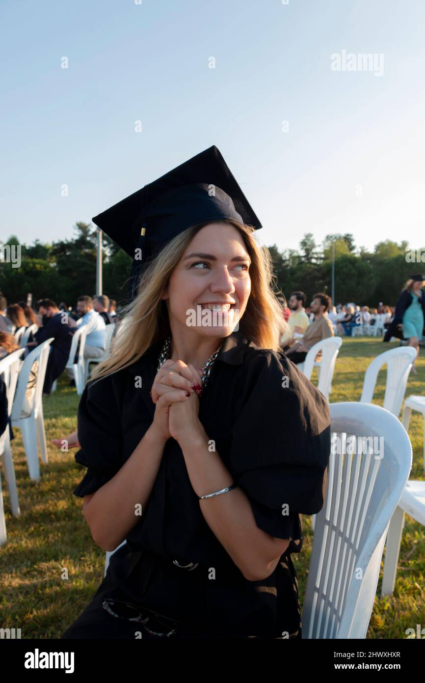 Graduduated student standing with cap. The girl graduated from ...