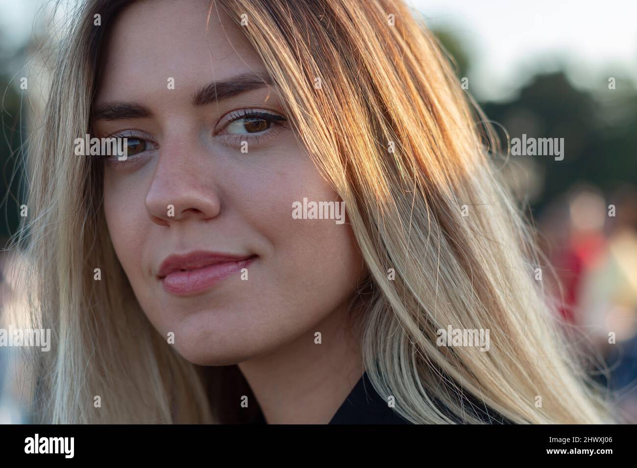 Portrait Of A Woman Close Up Photo She Looks Forward And Smiling
