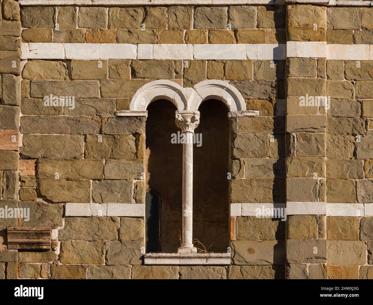 Medieval architecture in Lucca. A 12th century Bifora tye window with ...