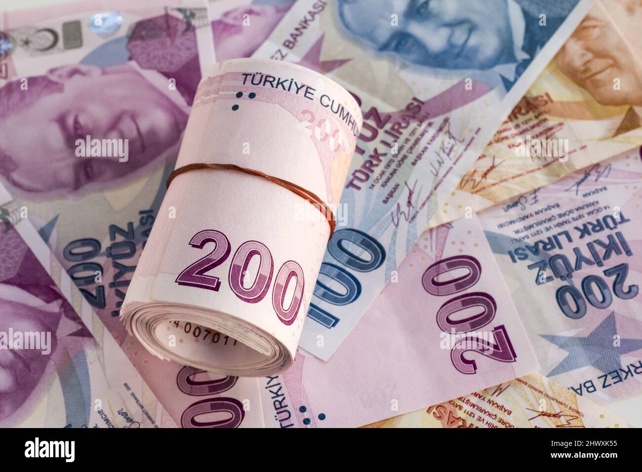 Two Hundred Turkish Banknotes rolled up on paper money.Monetary ...