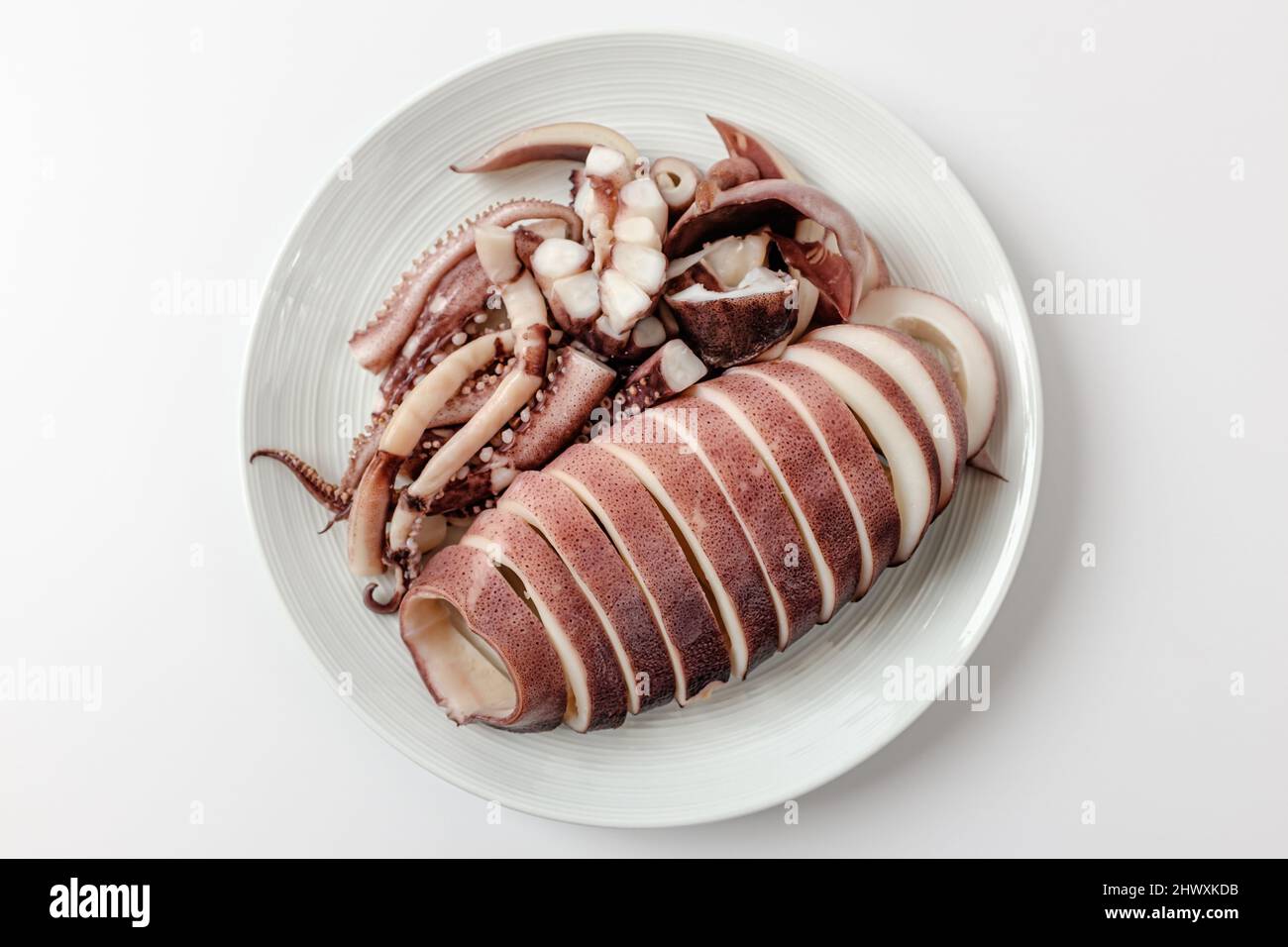 Roasted squid on a white background Stock Photo - Alamy